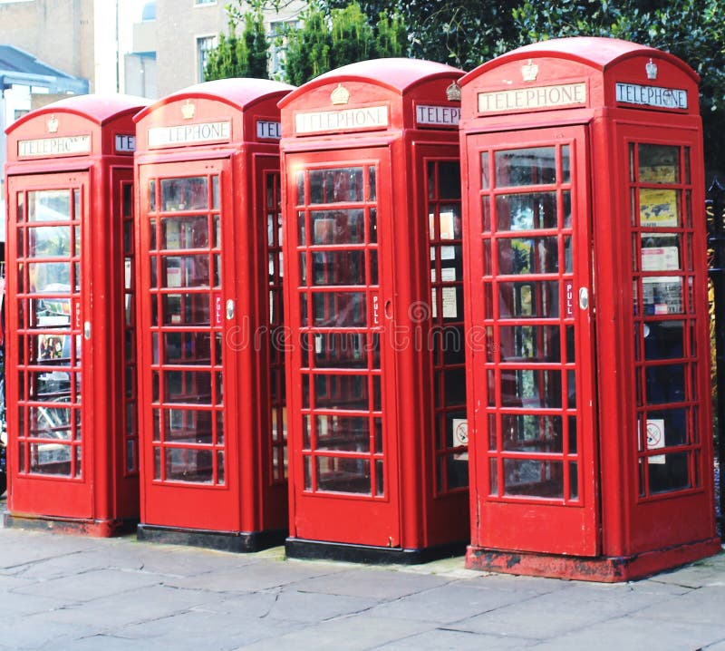 Four red phones booths. stock photo. Image of building - 271671988