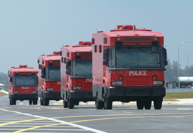 Four red police trucks stock photo. Image of riot, tarmac - 4932440
