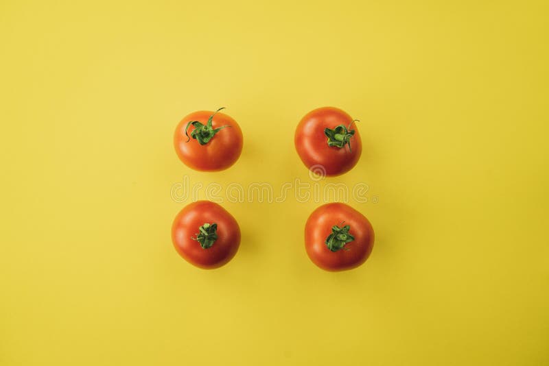 Four Red Tomatoes on Yellow Background. Stock Photo - Image of ...