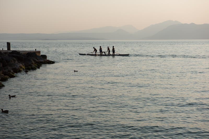 Four Rowers Rowing a Boat Standing Editorial Photo - Image of shadows ...
