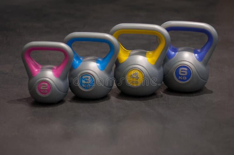 Four Several Plastic Weights of Different Weights and Colors Stock ...