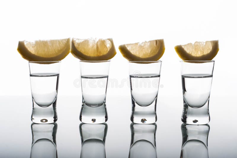 Four Shots of Vodka with Lemon Stock Image - Image of isolated, lime ...