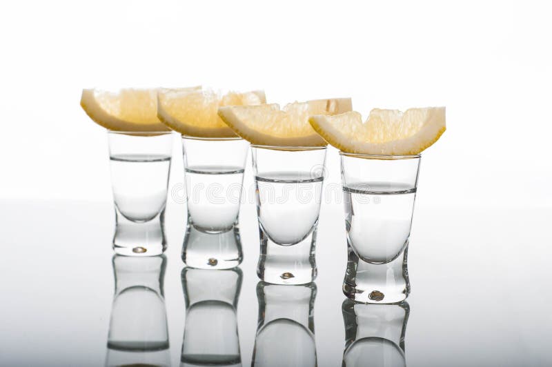 Four Shots of Vodka with Lemon Stock Image - Image of cool, four: 57582539
