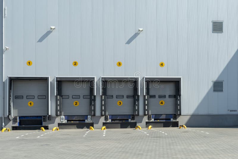 Four Shutter Doors at a Warehouse Stock Photo - Image of commercial ...