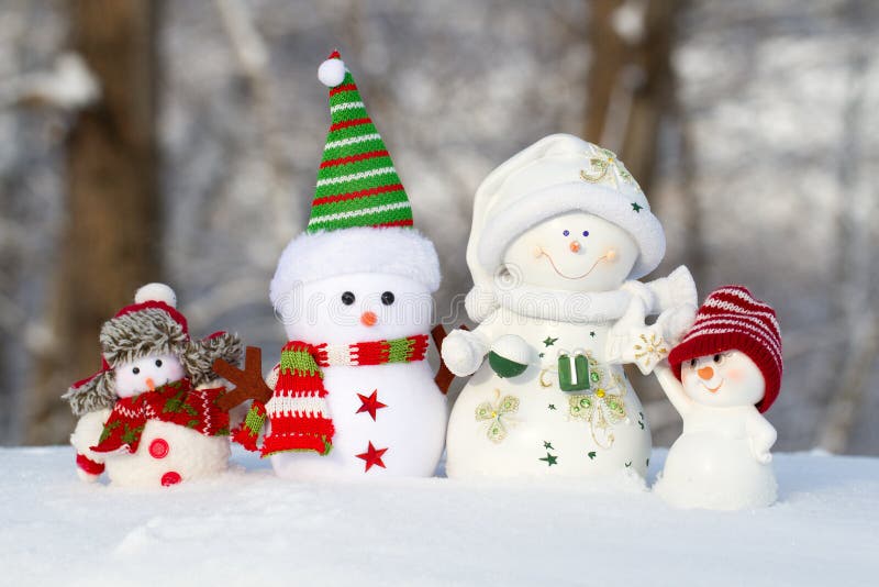 Four Snowmen on a Snow Stand in One Row Stock Image - Image of cold ...