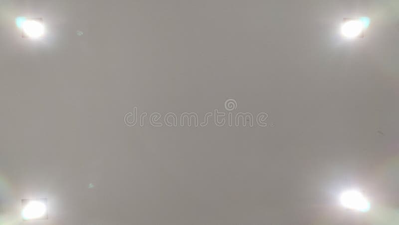 Four Spotlights Shine into the Frame, a Background with Lights in the ...