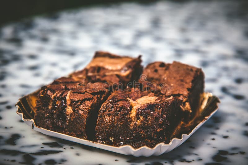 Four Square Pieces of a Brownie on a Marble Table Stock Photo - Image ...