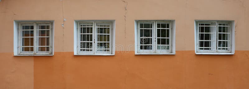 Four Square Windows with a Metal Barrier Stock Image - Image of ...