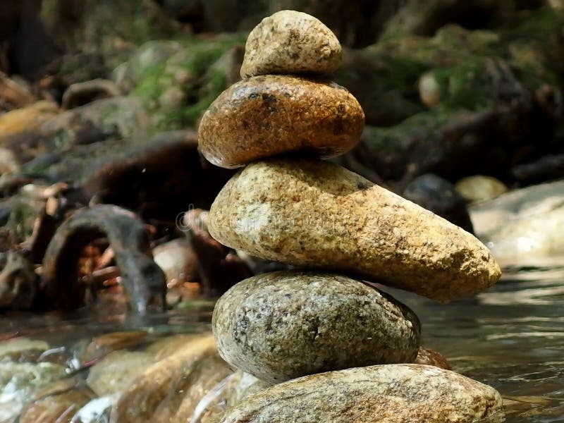 Four stones balanced stock photo. Image of rock, green - 110371148