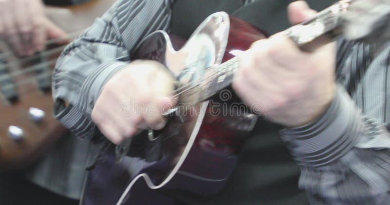 Four strings guitar player stock footage. Video of playing - 184608456