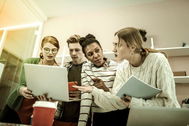 Four Students Enjoying Their Group Study at the Weekend Stock Image ...