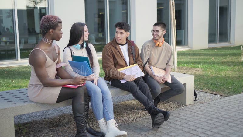 Four Students Sitting on the University Campus. Multi-ethnic Group of ...