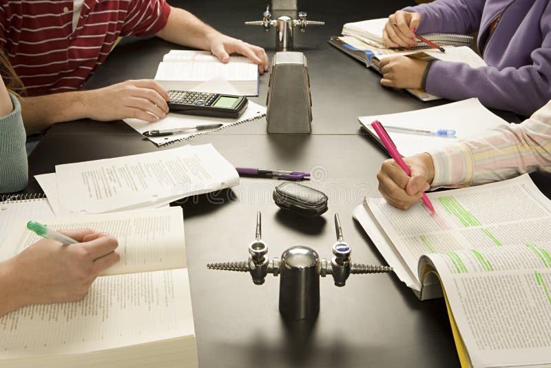 Four Students Working in a Classroom Stock Image - Image of classroom ...