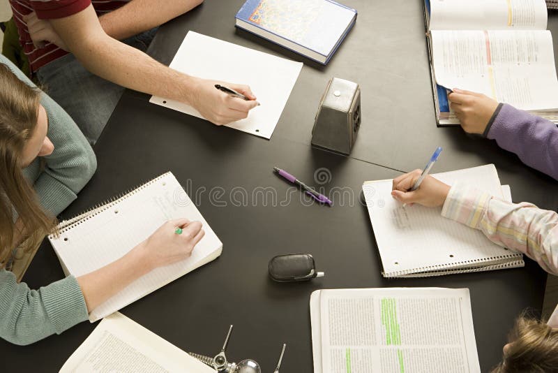 Four Students Working in a Classroom Stock Photo - Image of multi ...