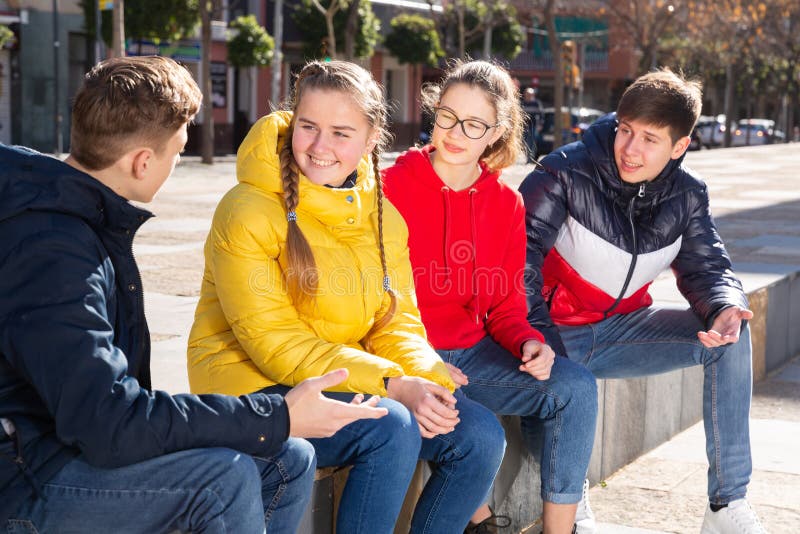 Teenagers talking outdoor stock photo. Image of meeting - 24701754