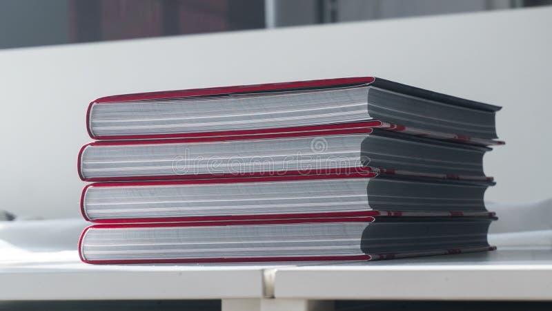 Four Thick New Books on a White Table Stock Image - Image of edition ...