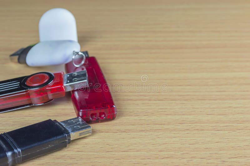 Four USB Flash Drives on Wood Table and Copy Space Stock Photo - Image ...