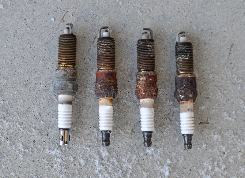 Four Used Automotive Spark Plugs Stock Photo - Image of macro, ignition ...