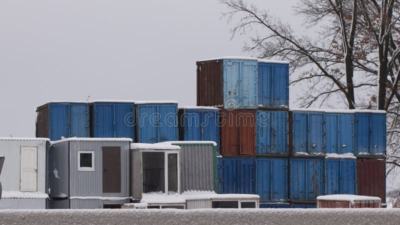 Four Vertical Rows of Shipping Containers that are Different Colors ...