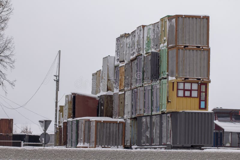 Four Vertical Rows of Shipping Containers that are Different Colors ...