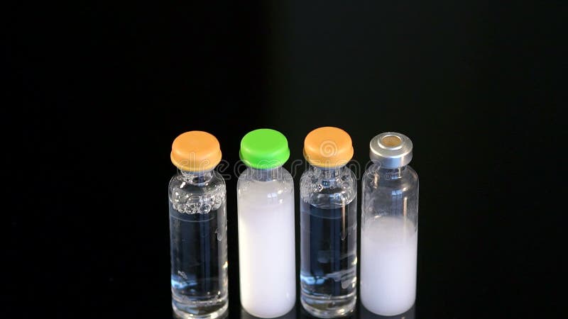Four Vial Insulin Close-up on Black Background. Stock Video - Video of ...
