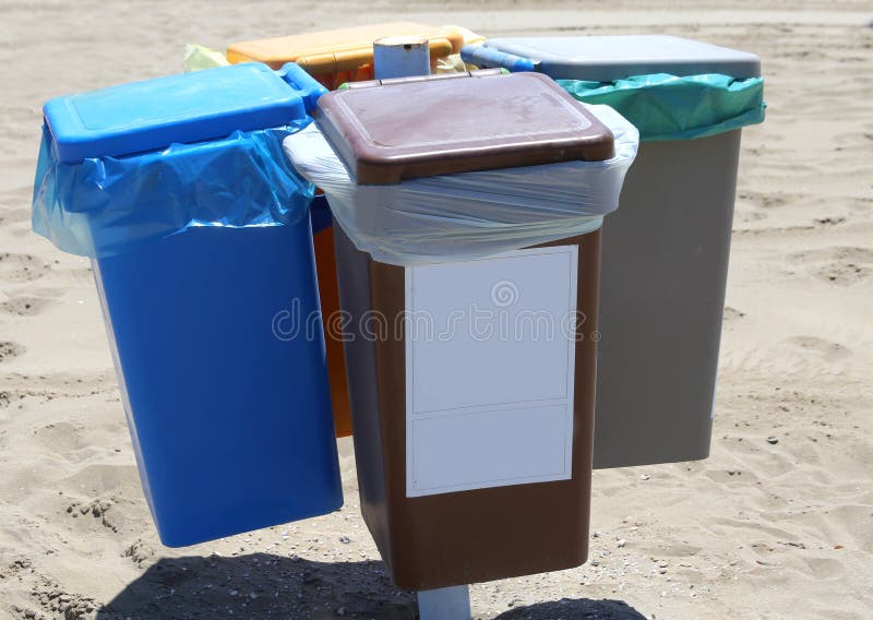 Four Waste Bins for the Separate Collection of Garbage on the Be Stock ...