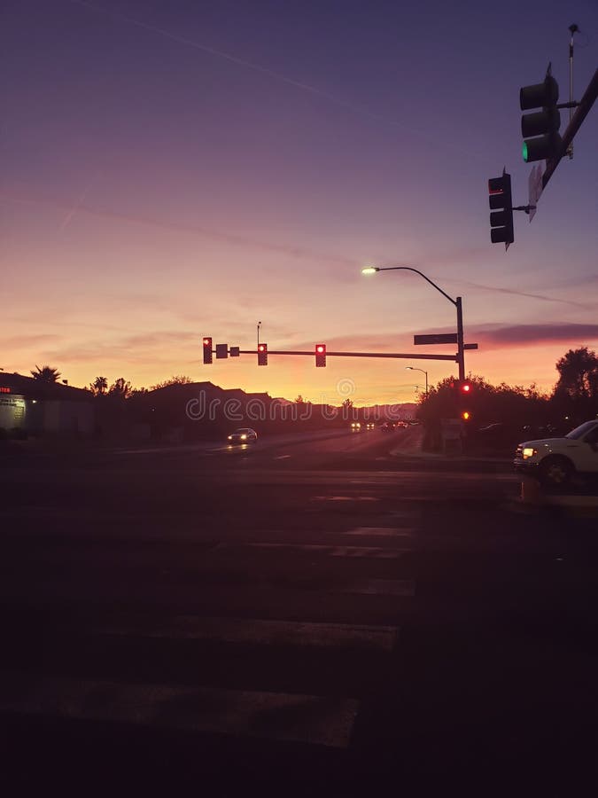Four-way Intersection at Dusk Stock Image - Image of light, black ...