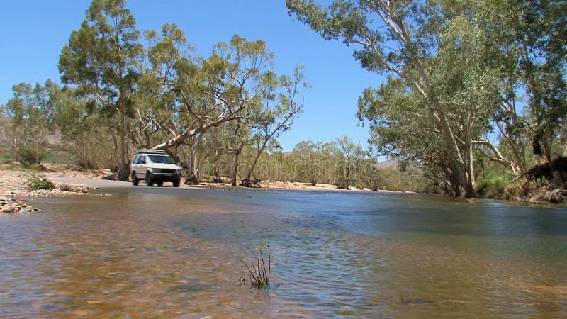 Four Wheel Drive Driving through the Water, in the Outback in Australia ...
