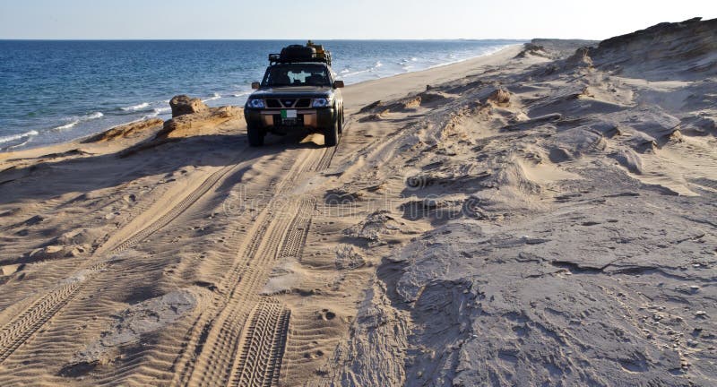 Four Wheel Drive Vehicle on a Remote Beach Stock Image - Image of ...