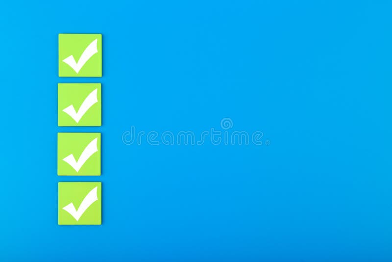 Four White Checkmarks on Green Tablets in a Row Against Blue Background ...