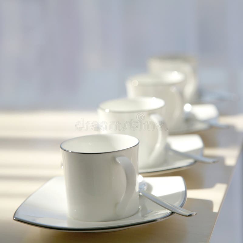 Four white cups stock image. Image of guests, restaurant - 3522533