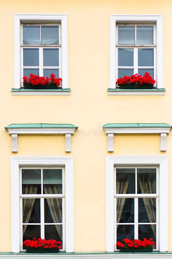 Four Windows with Red Flowers Stock Image - Image of building, exterior ...