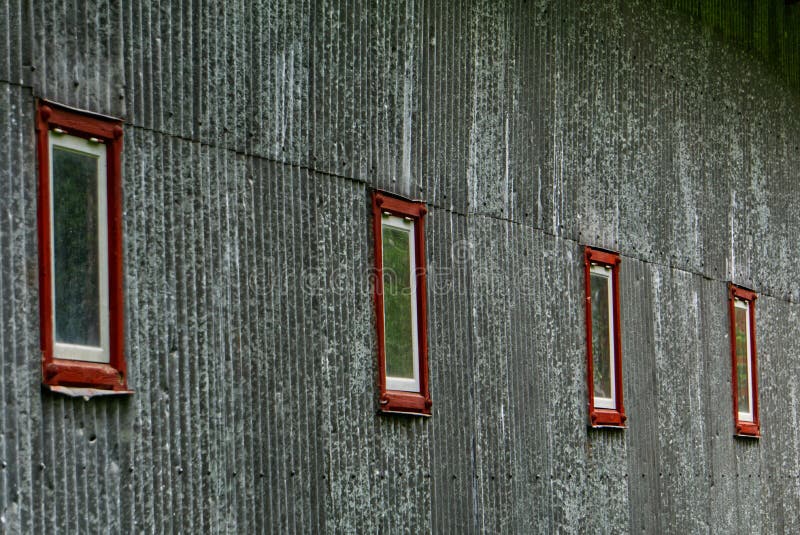 Four Windows with Red Frame on Tin Wall Stock Photo - Image of wood ...
