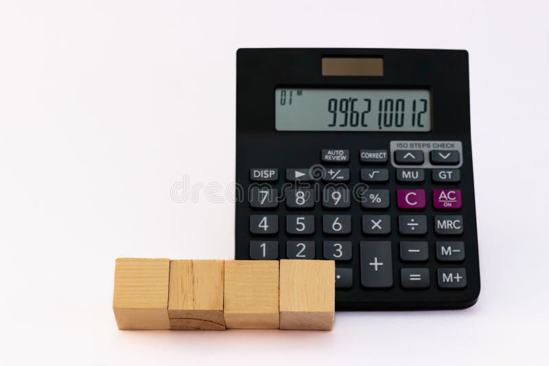 Four Wooden Blocks Placed Horizontally on the Base of a Calculator for ...