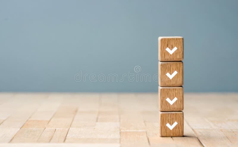 Four Wooden Blocks Stacked with Check Marks. Concept of Task Completion ...