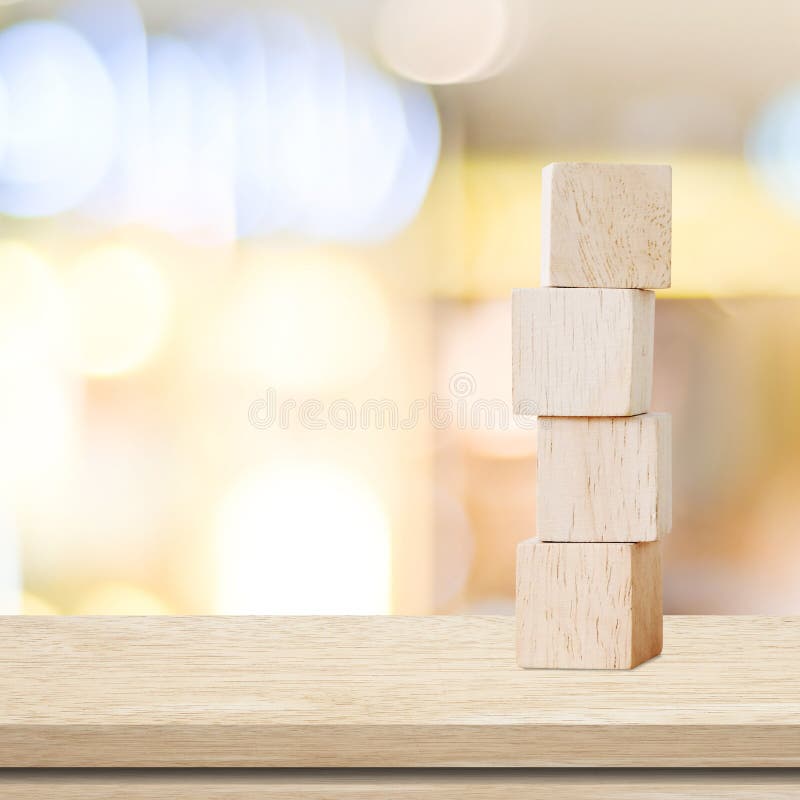 Four Wooden Cubes Table Over Blur Abtract Bokeh Background Stock Photos ...