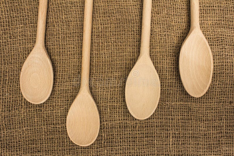 Four Wooden Spoons stock photo. Image of wood, jute, utensils - 28261616