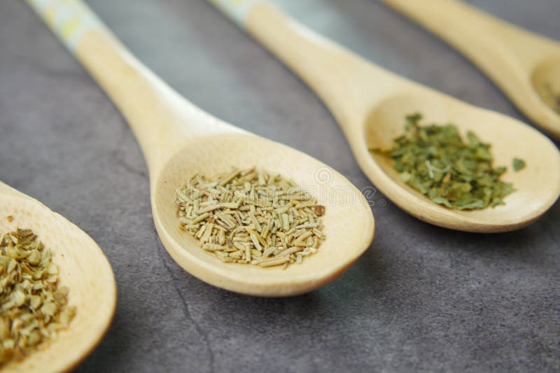 Four Wooden Spoons Holding Various Spices on a Table Stock Image ...
