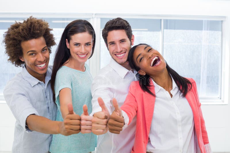 Four Workers Giving Thumbs Up and Smiling To Camera Stock Image - Image ...