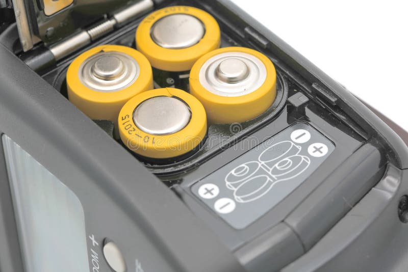 Four Yellow Rechargeable Batteries in Camera Flash, Close Up Stock ...