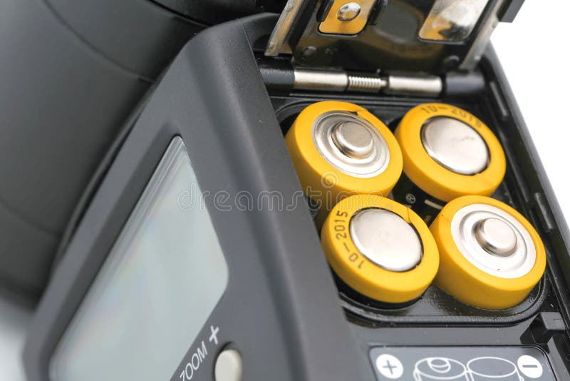 Four Yellow Rechargeable Batteries in Camera Flash, Close Up Stock ...