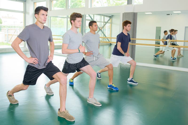Four Young Men Exercising Stepping Forward Stock Image - Image of white ...