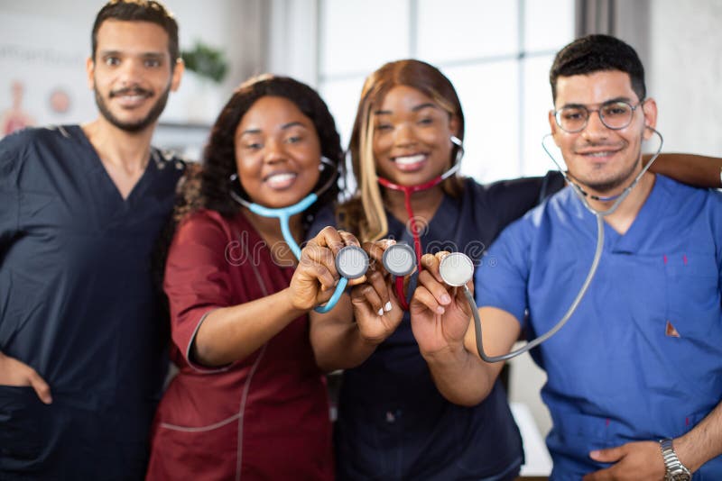 Group of Smiling Doctors with Stethoscopes Stock Image - Image of coat ... Group of Smiling Doctors with Stethoscopes Stock Image - Image of coat ...