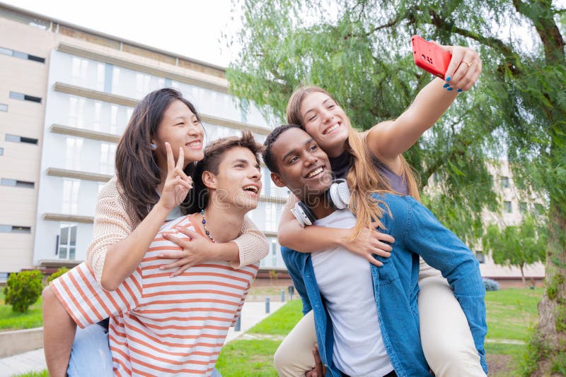 Four Young Multiracial Friends Taking A Selfie Portrait Together
