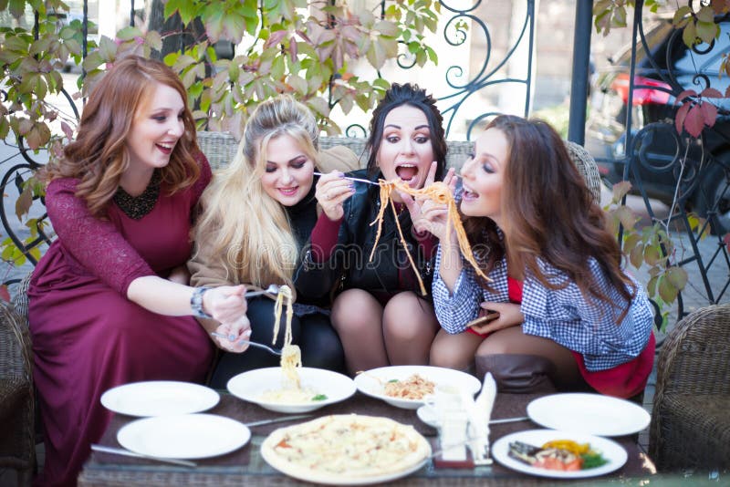 Four Young Women Having Lunch in a Cafe Stock Image - Image of cafe ...