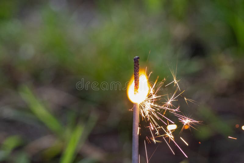 Fourth of July Sparkler with Ground Back Ground Stock Photo - Image of ...