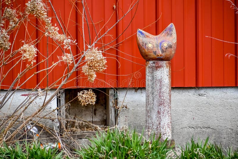 Fox Statue by a Red Barn stock photo. Image of pillar - 214955532