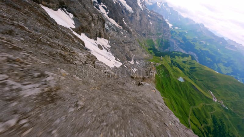 FPV Flight Diving Down West Flank of the EIGER Switzerland Grindelwald ...