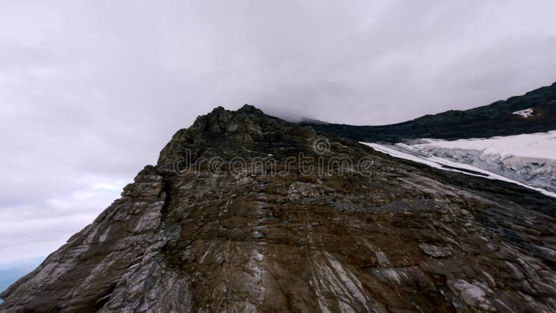 FPV Flight Diving Down West Flank of the EIGER Switzerland Grindelwald ...
