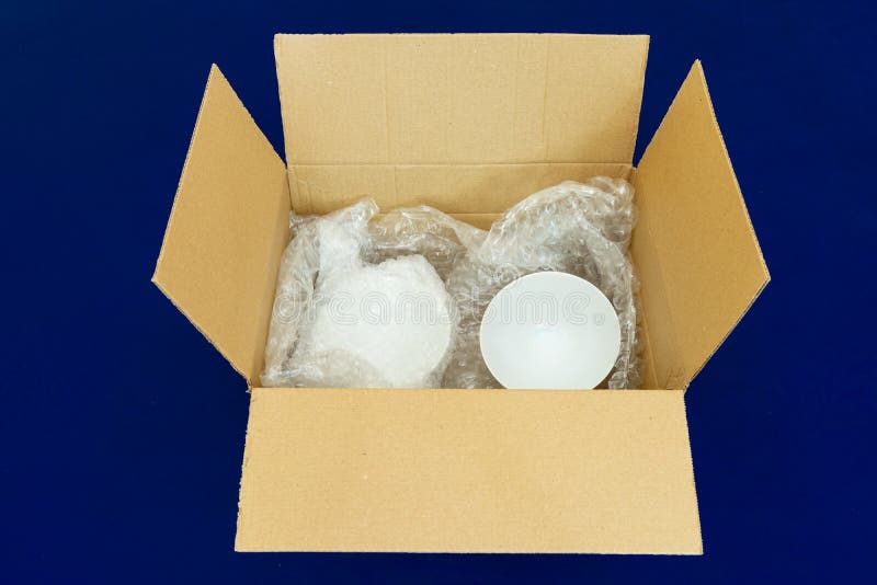 Fragile Items Wrapped in Protective Packaging in a Box Stock Photo ...